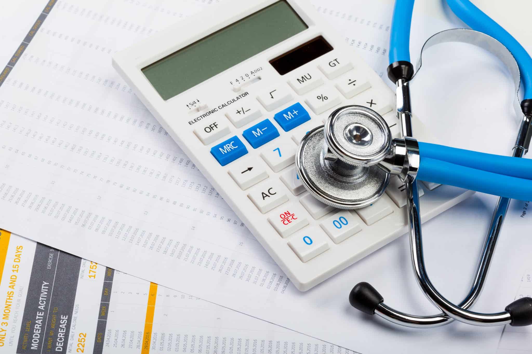 Health care costs. Stethoscope and calculator - Main Street Bank